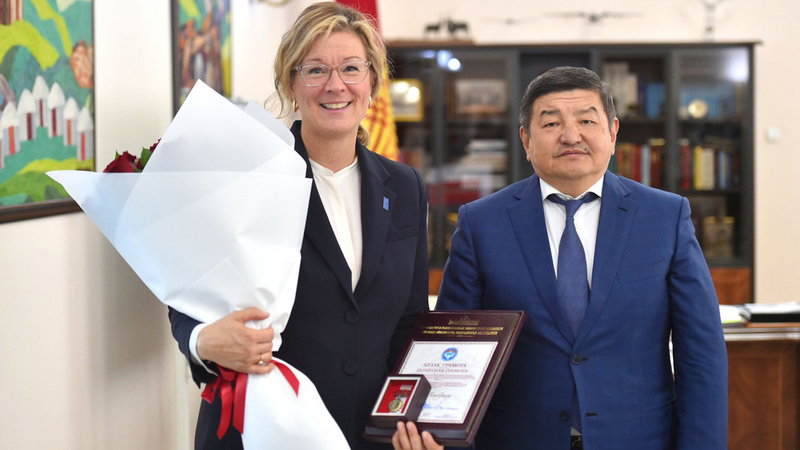 UNDP Resident Representative Louise Chamberlain presented with a ...